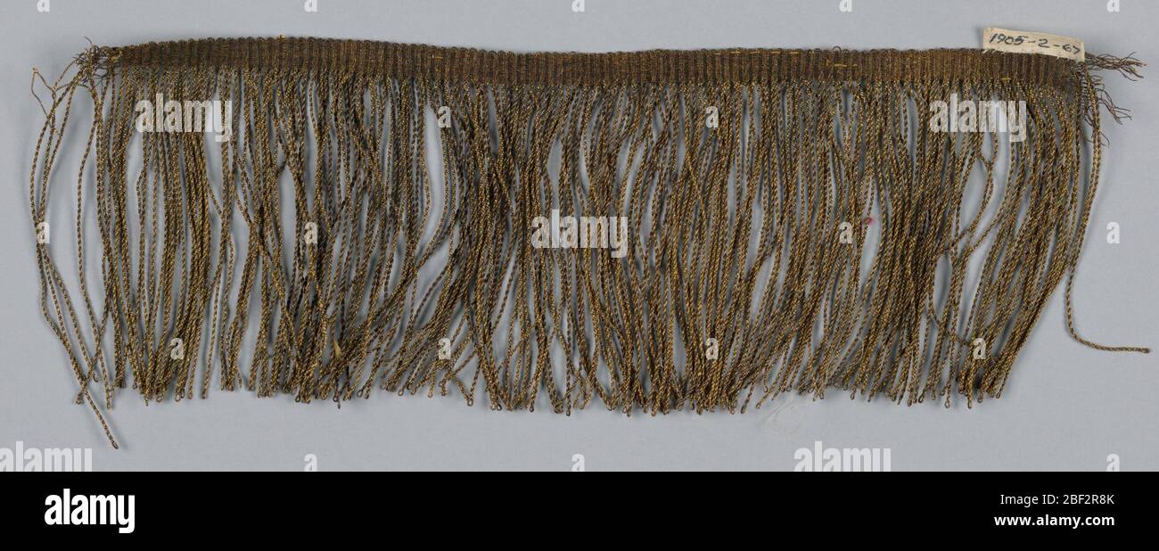 Fringe. Gold fringe with a plain-woven heading a skirt of twisted loops ...