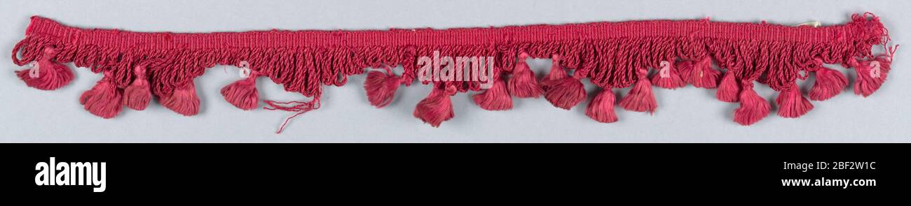 Fringe. Fringe of red and gold threads with a heading and looped skirt ...