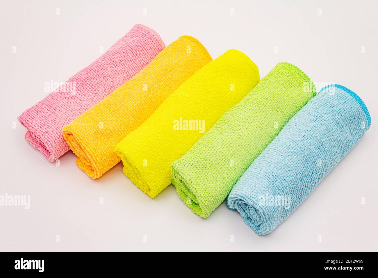 Set of colorful dusters isolated on white background. House cleaning ...