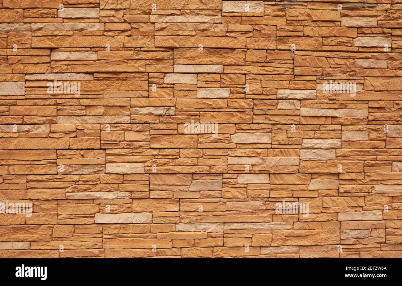 Brick background, wall or texture of orange blocks Stock Photo - Alamy