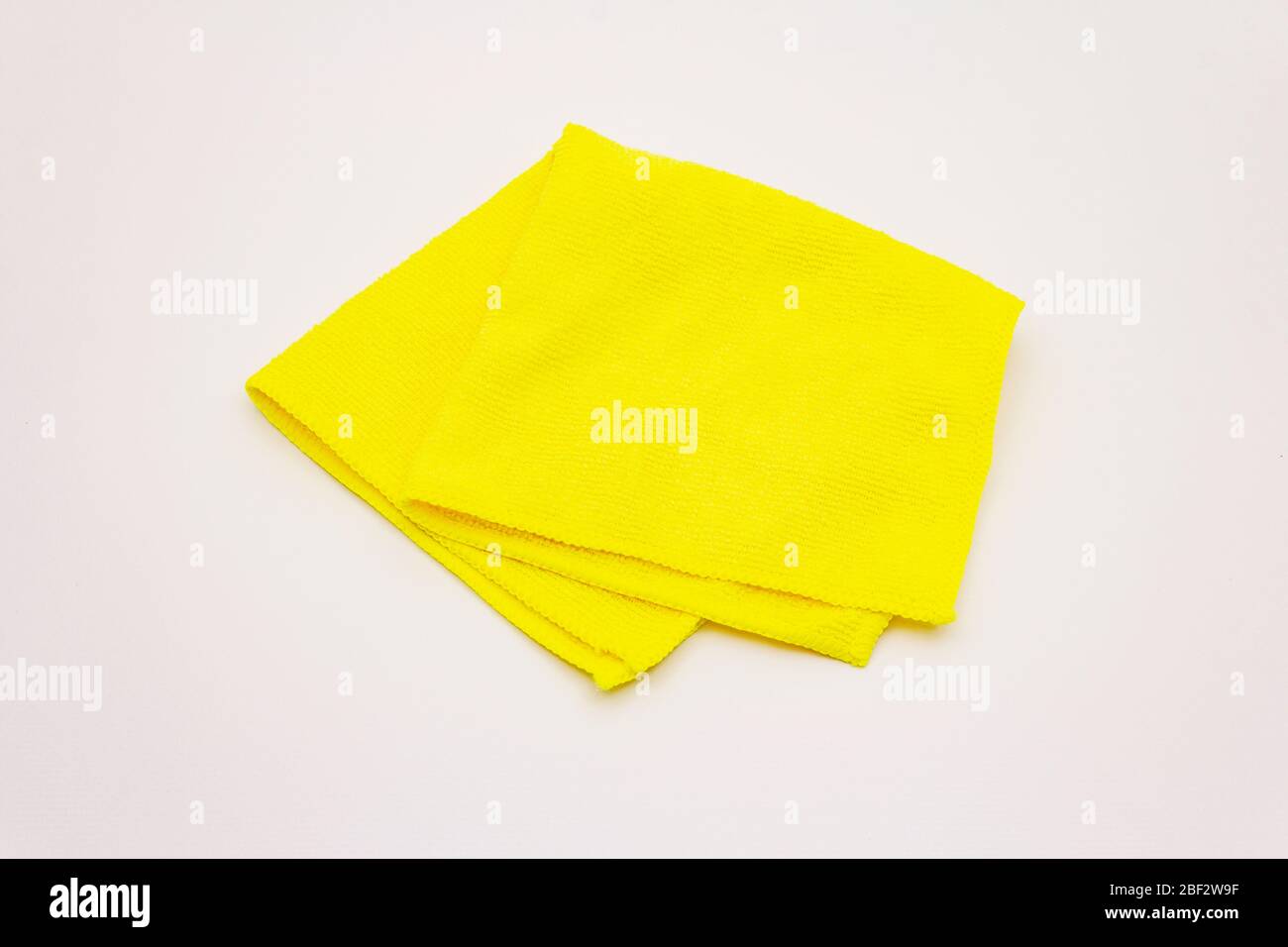 Yellow duster isolated on white background. House cleaning product ...