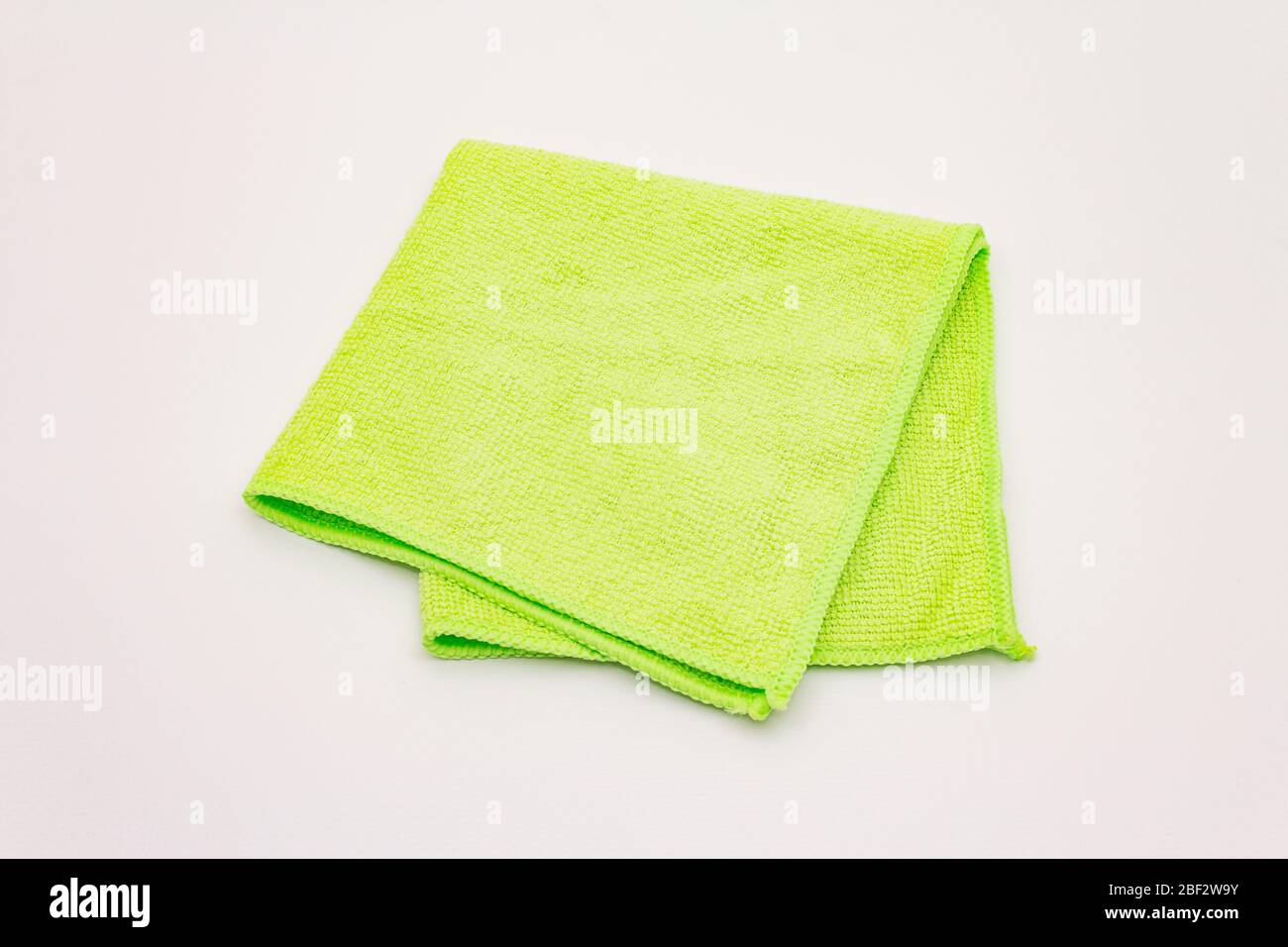 Green duster isolated on white background. House cleaning product, home ...