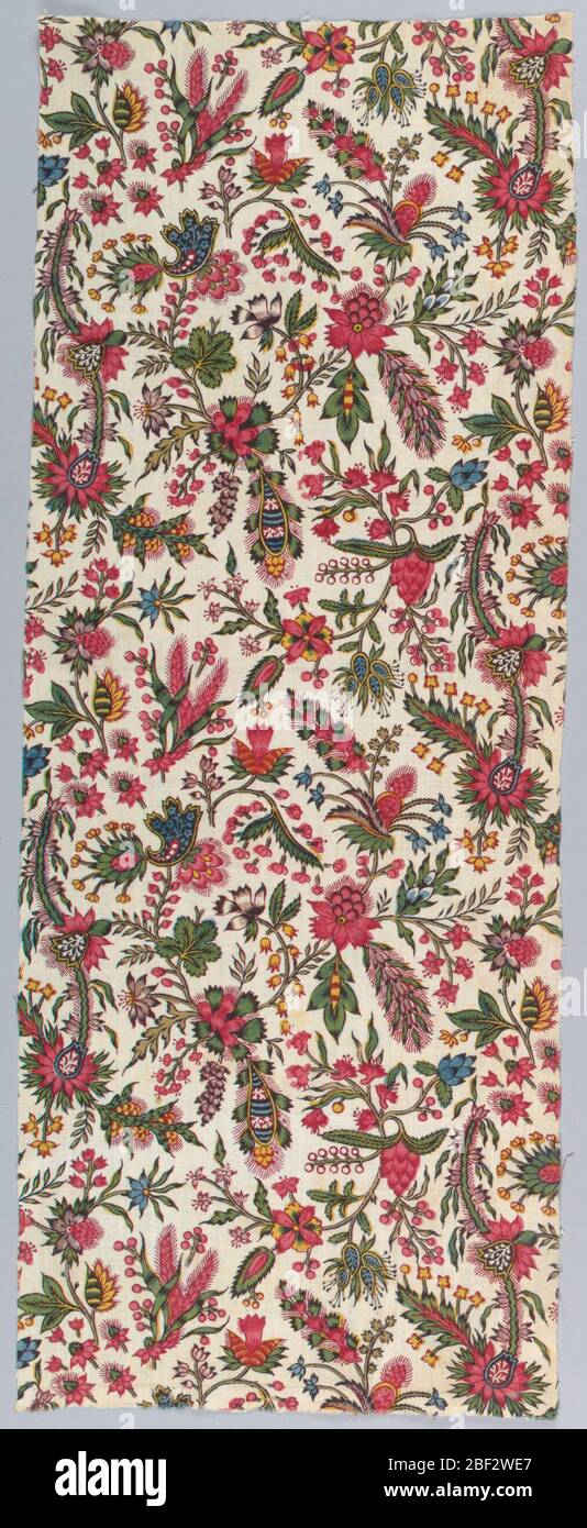 Textile. Dense pattern of small scale, brightly colored exotic plants ...