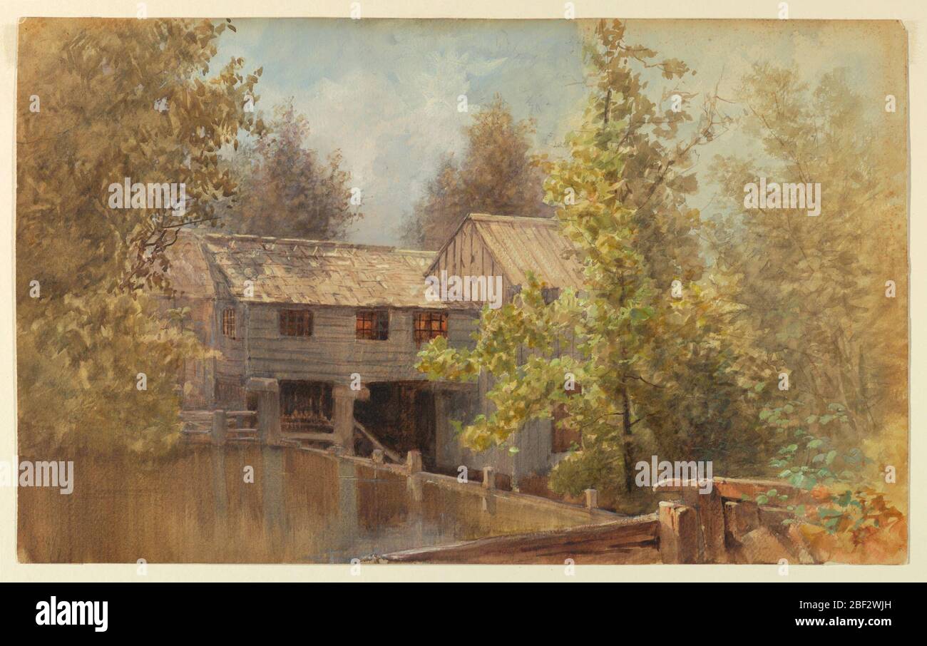 Old Grist Mill. View of an old mill seen across the pond, partially ...