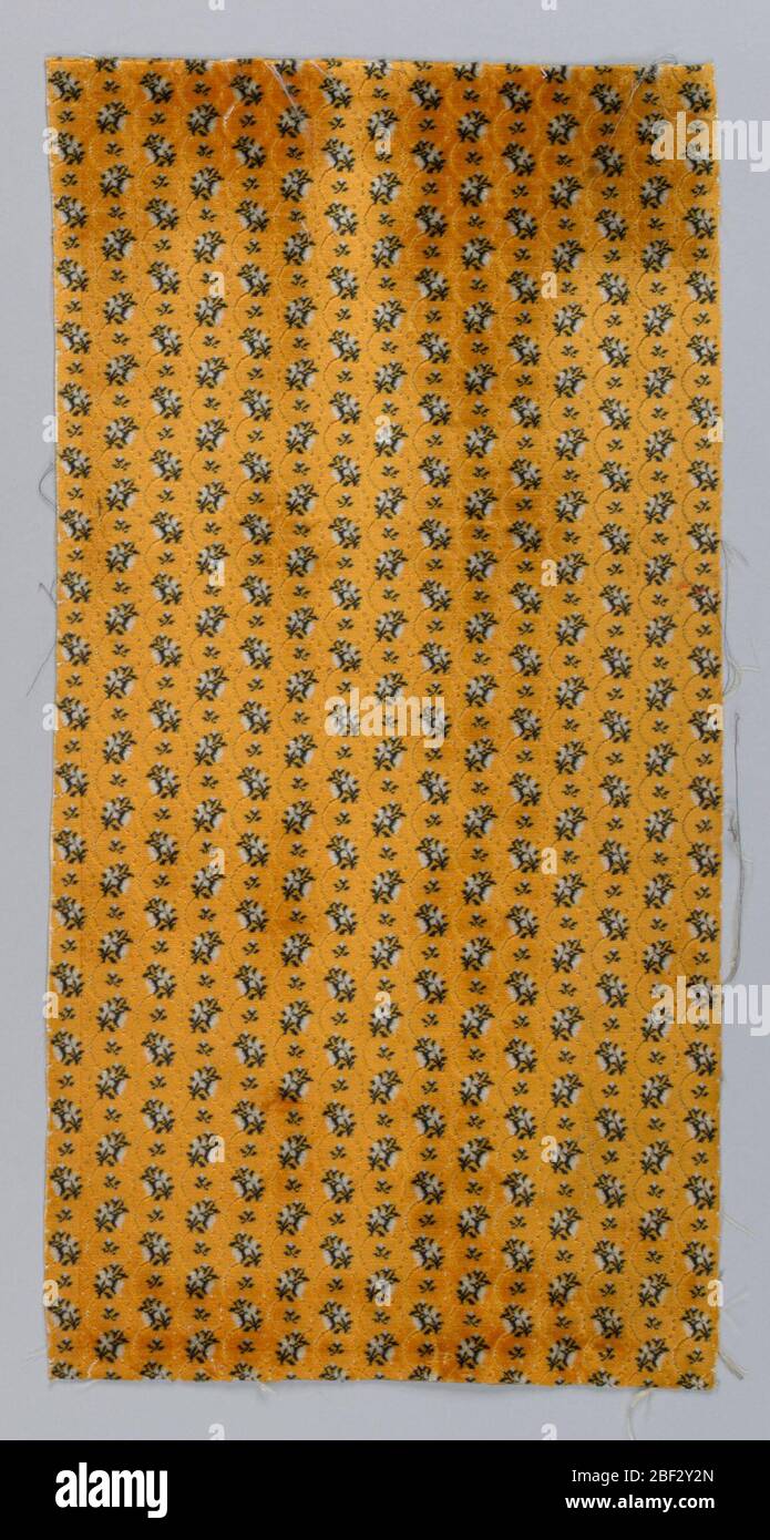 Fragment. Deep golden yellow ground with a fine tiny design of black ...