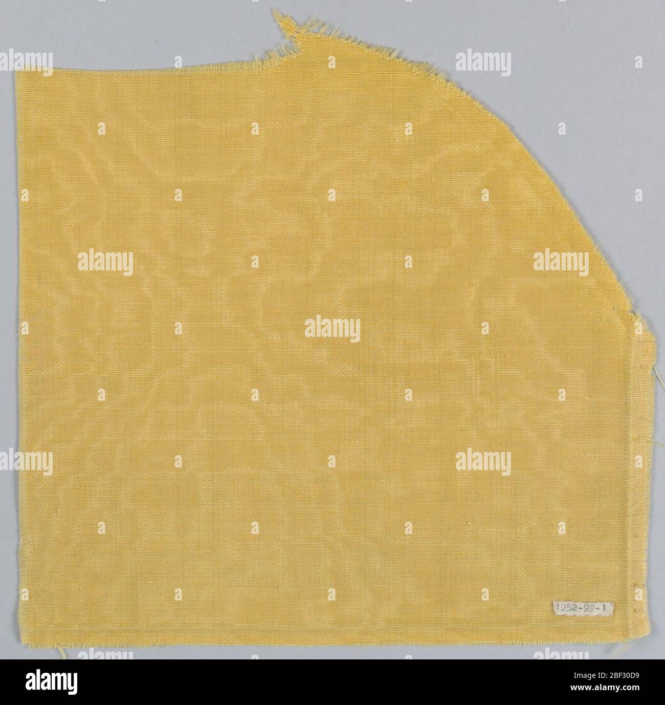 Embossed wool. Bright golden yellow woolen cloth, moire and glazed on ...