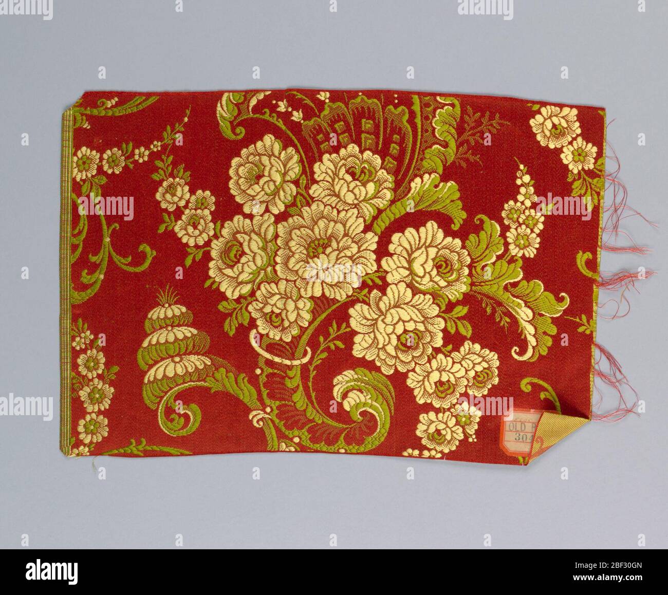 Samples. a. orange/red ground (warp) with motifs in green and yellow ...