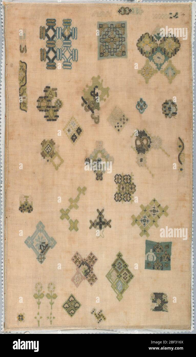 Sampler. Spot sampler embroidered in blues, greens, yellows, gold and ...