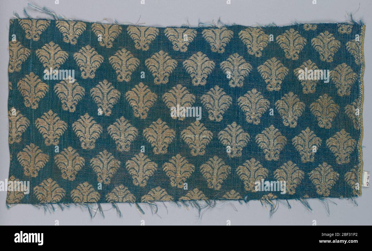 Textile. All-over pattern of small-scale, stylized floral forms ...