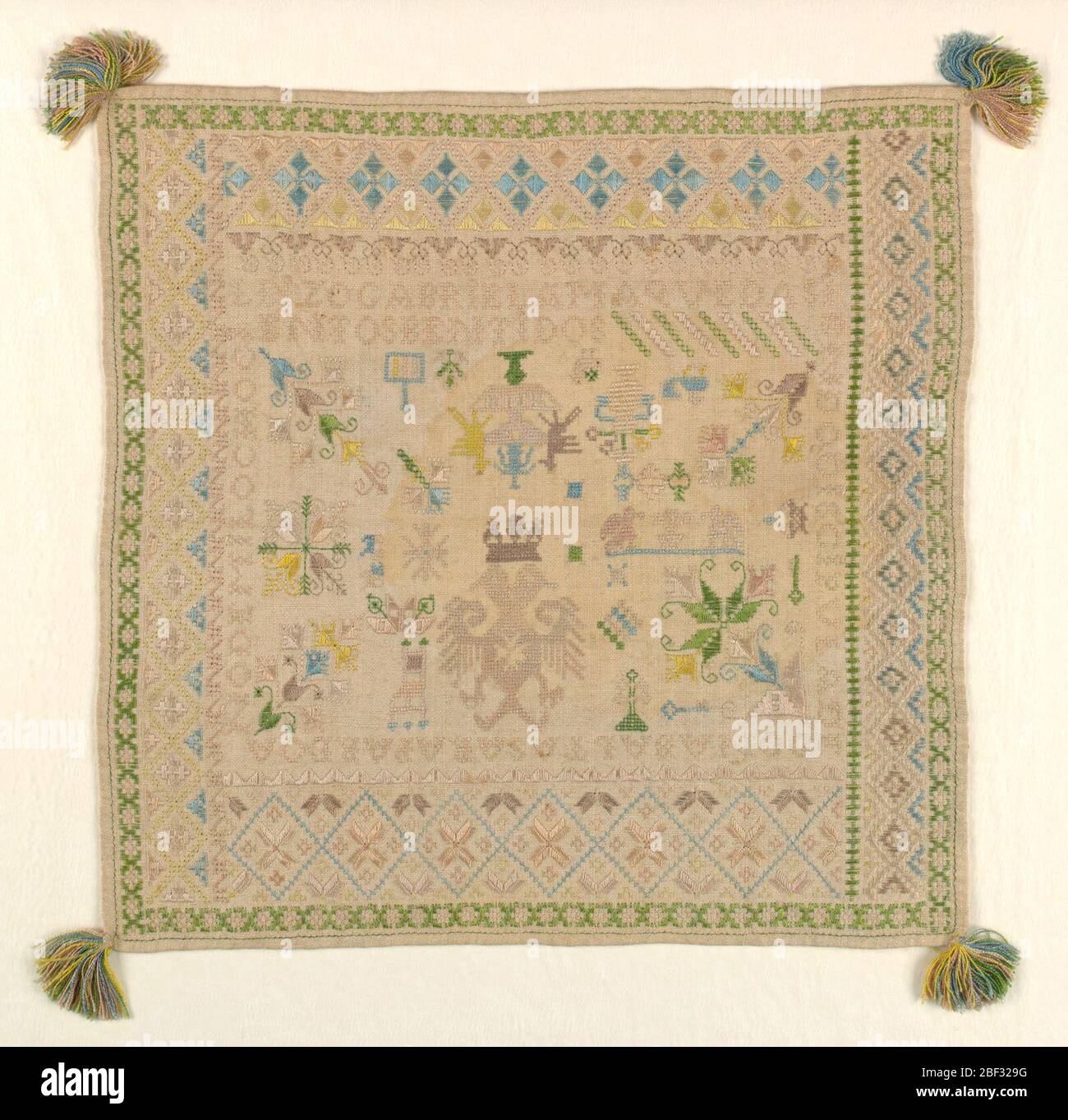 Sampler. Center field with spot motifs, including double-headed eagle ...