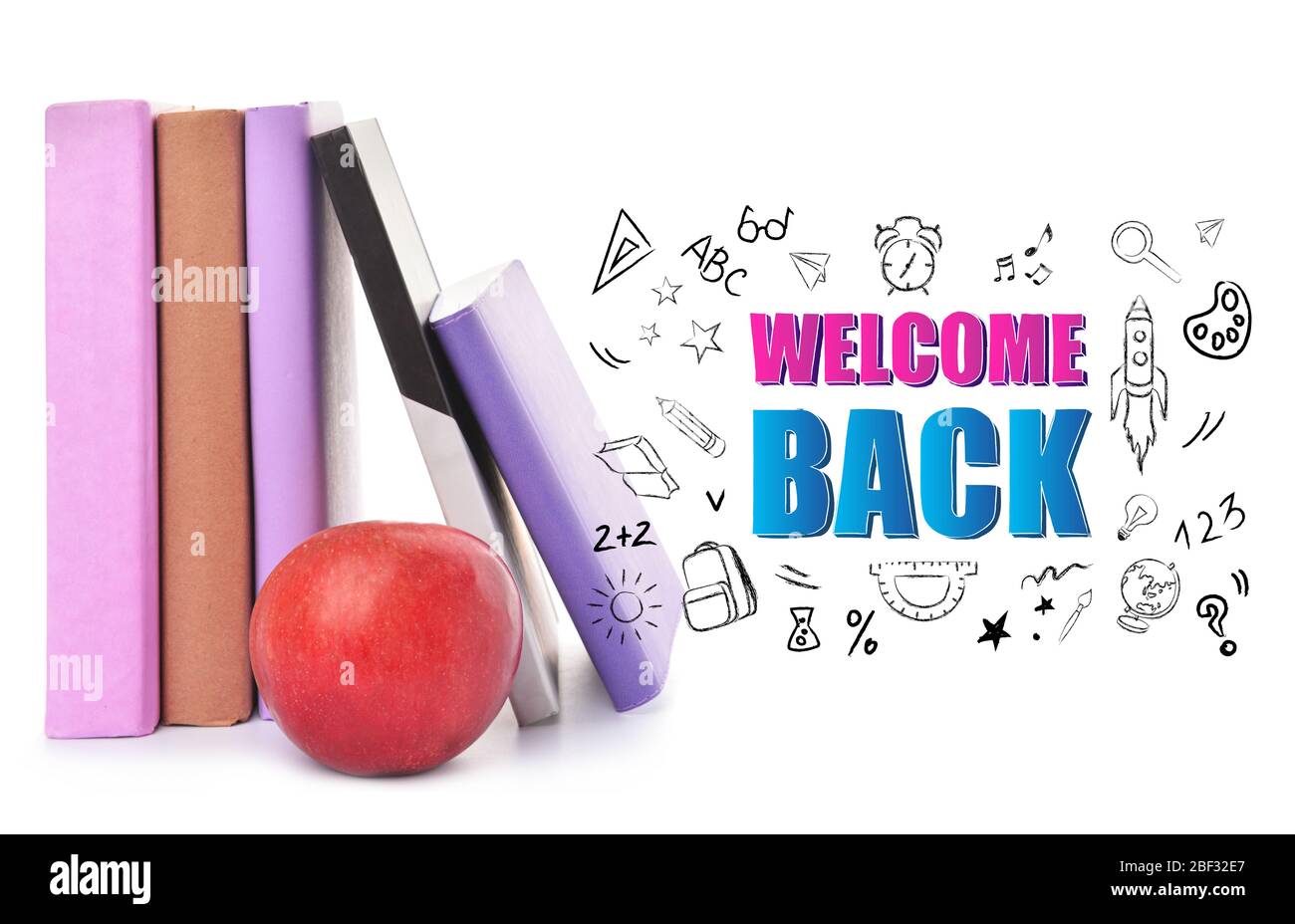 School books, apple and text WELCOME BACK on white background Stock ...
