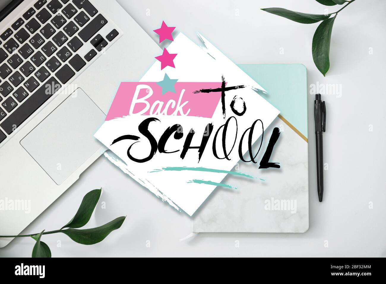 Text BACK TO SCHOOL with laptop and stationary on white background ...