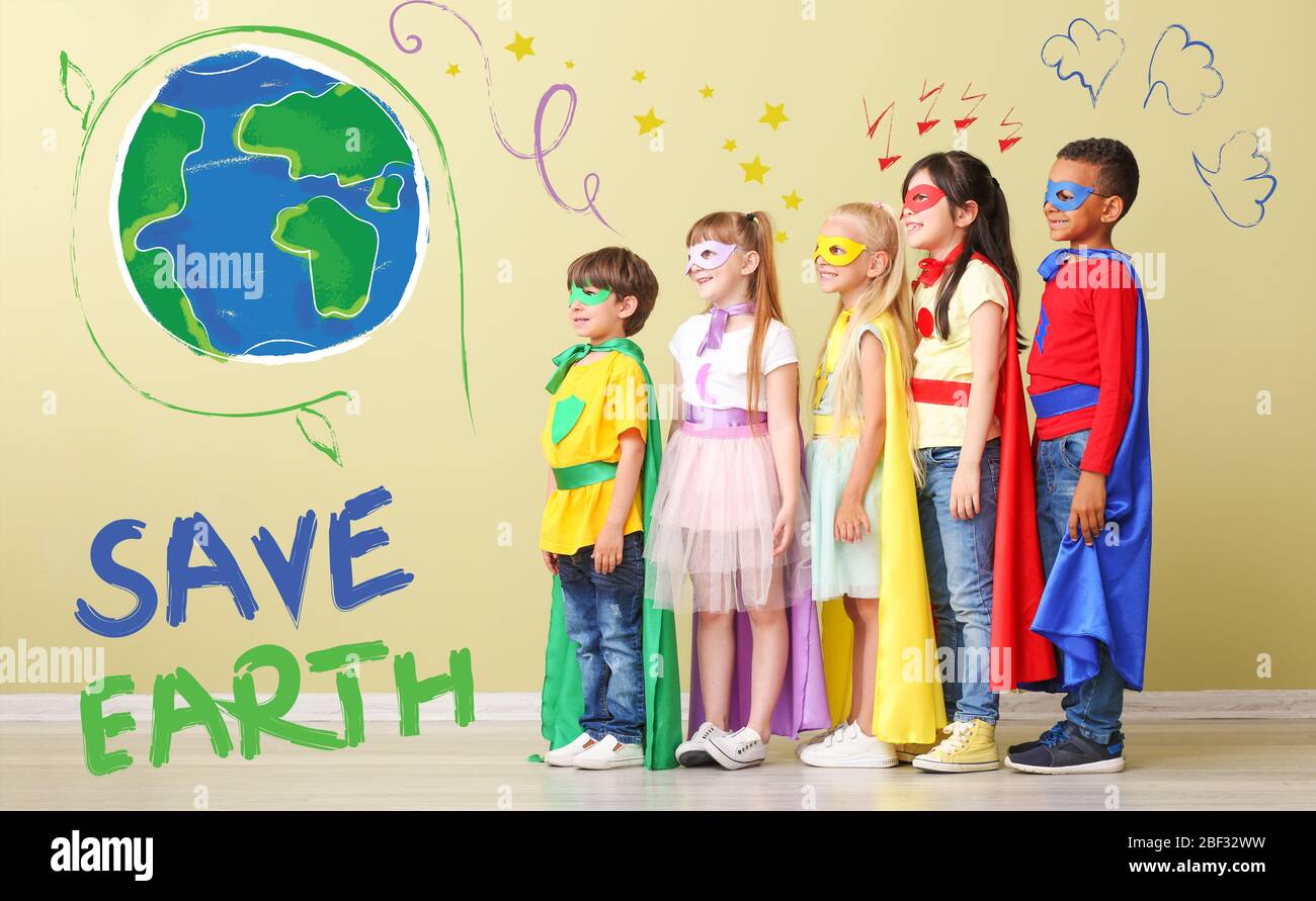 Cute little superheroes near wall with drawn planet and text SAVE EARTH ...