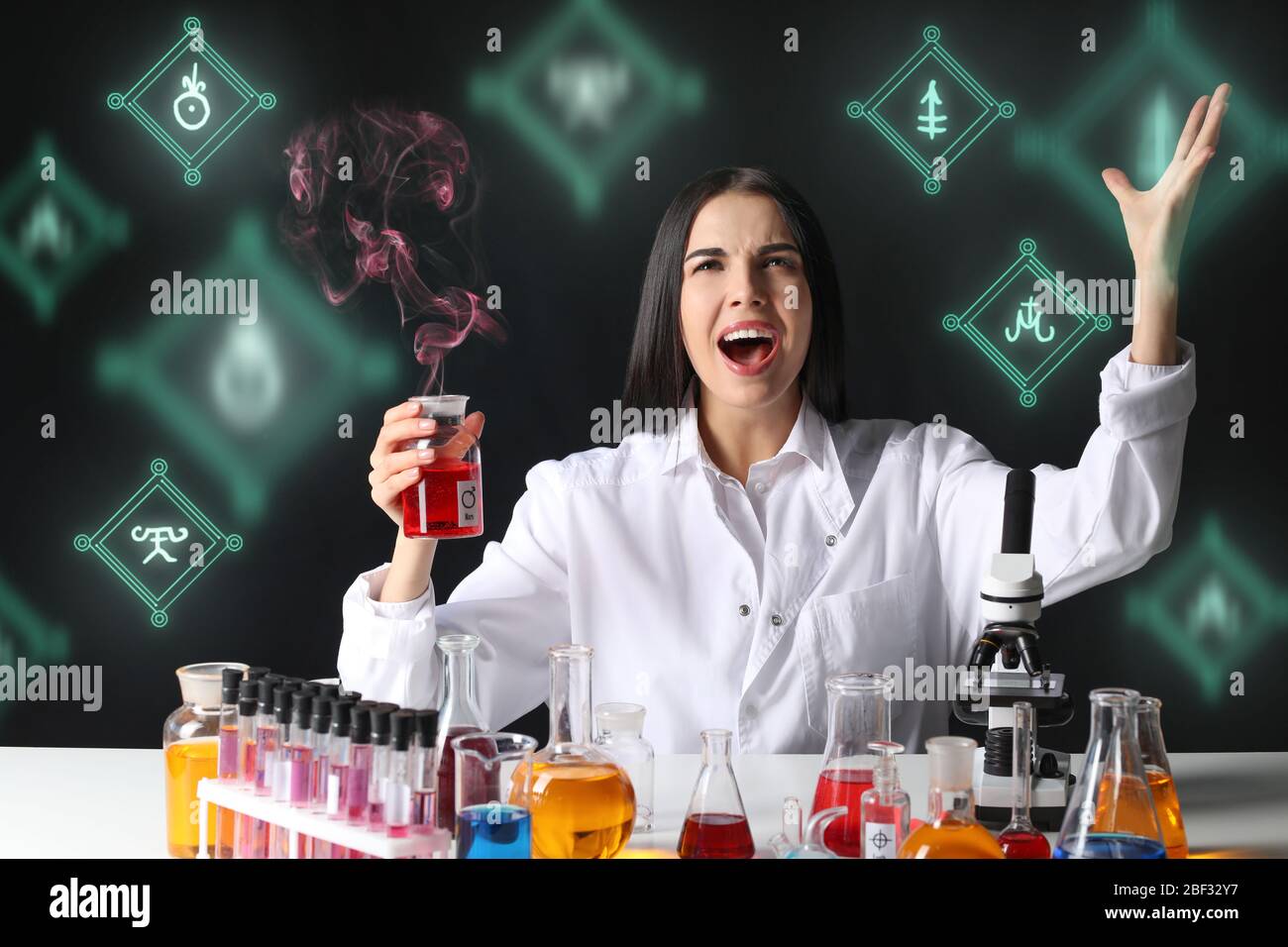 Crazy female alchemist making elixir in laboratory Stock Photo - Alamy