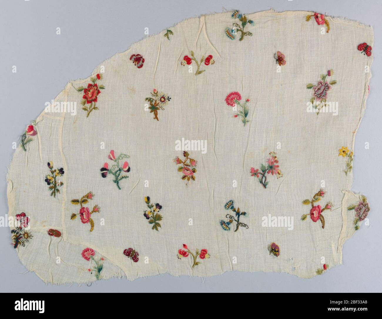 Fragment. Pieced fragment of sheer white muslin embroidered in small ...