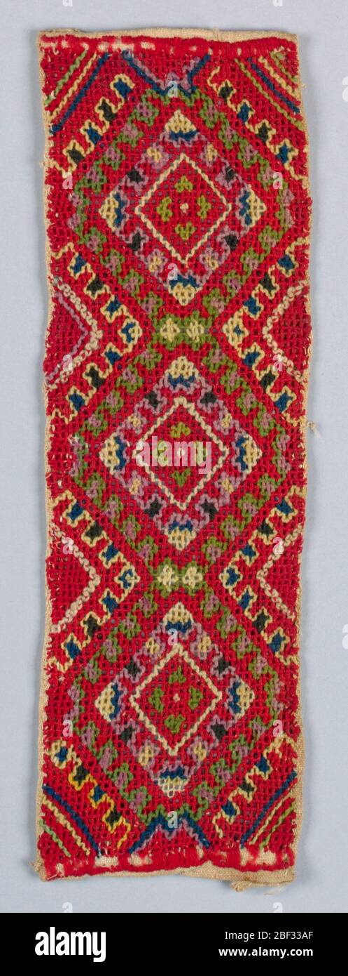 Embroidery. Red woven linen cuff embroidered with deflected wool ...