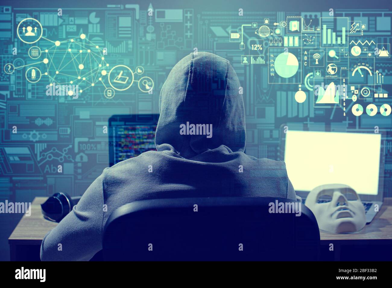 Professional hacker using computer in dark room Stock Photo - Alamy