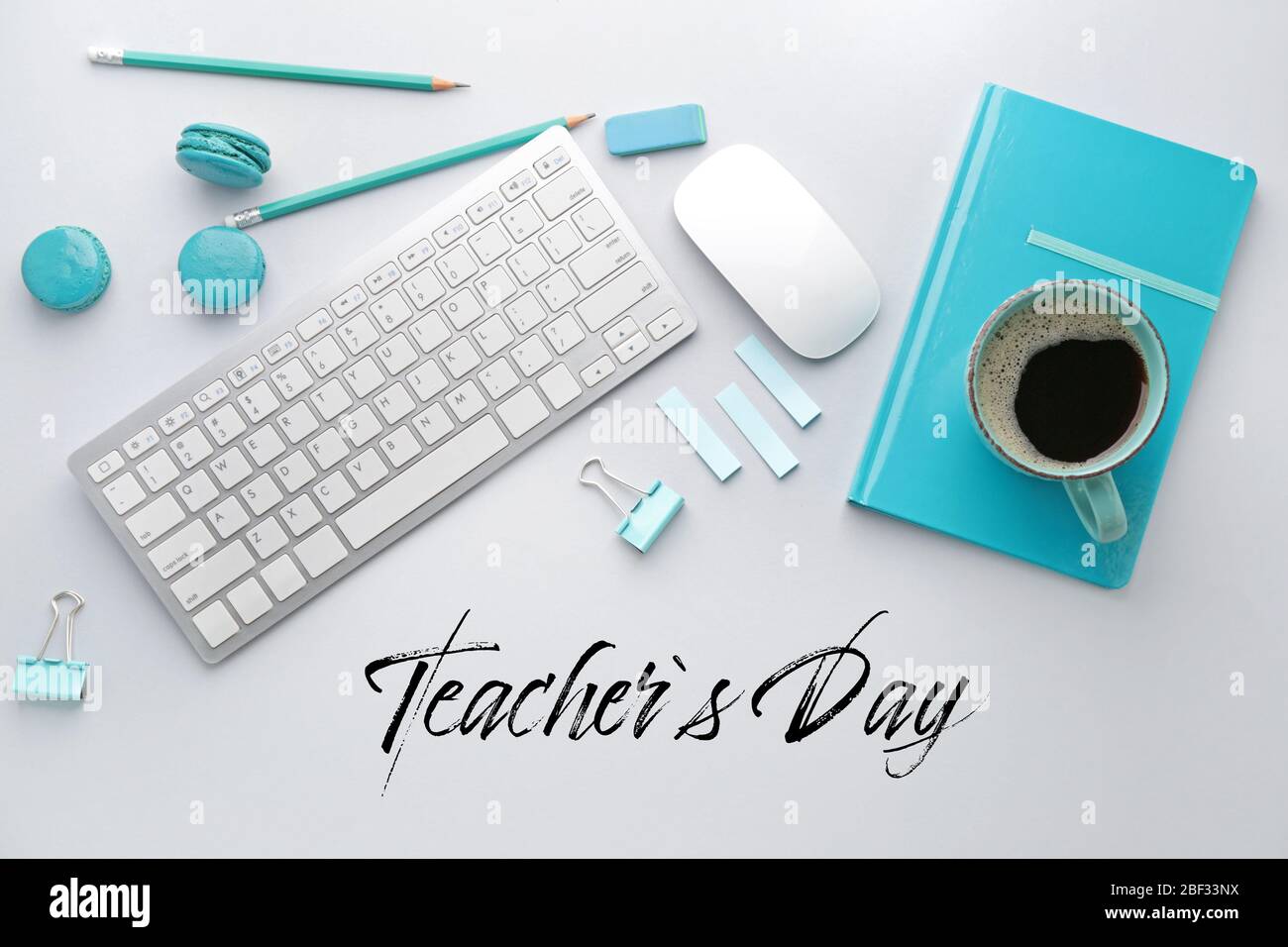 PC keyboard, mouse, cup of coffee and stationery on light background ...