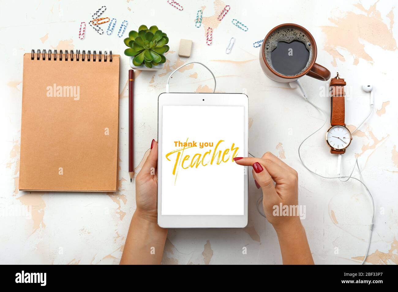 Woman with modern tablet computer at table, top view. Teacher's Day ...