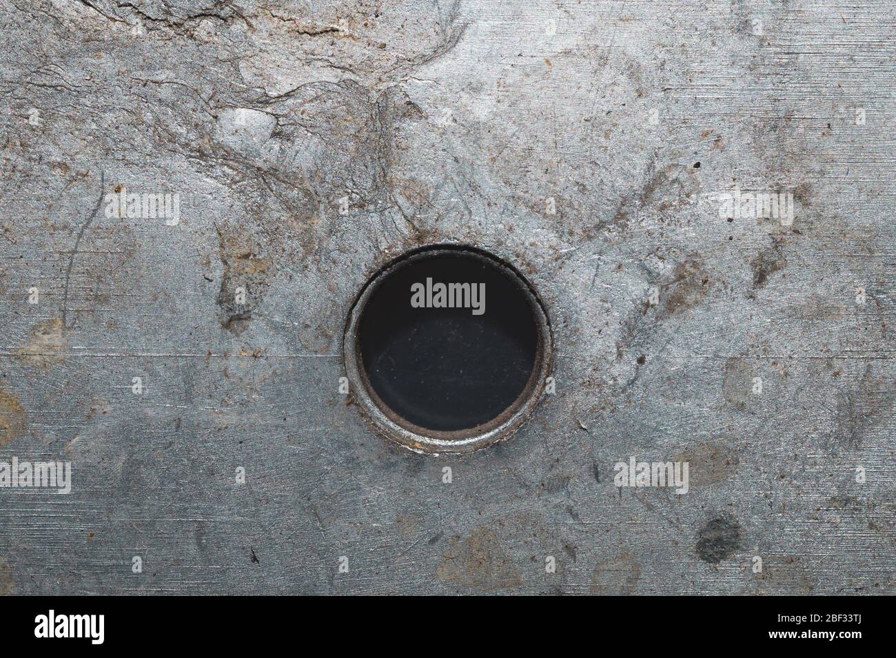 Iron plate macro. metal sheet with hole. steel background close up ...