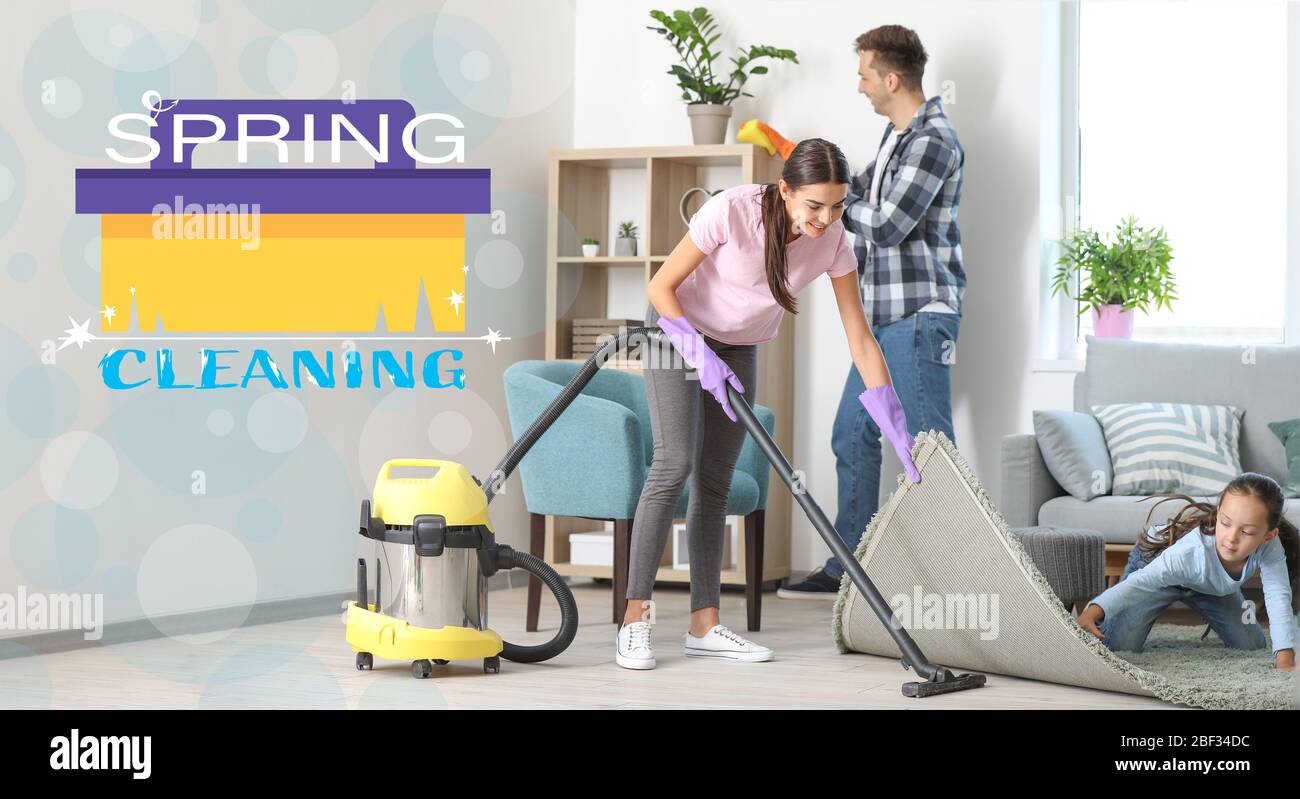 Happy family cleaning flat together Stock Photo - Alamy