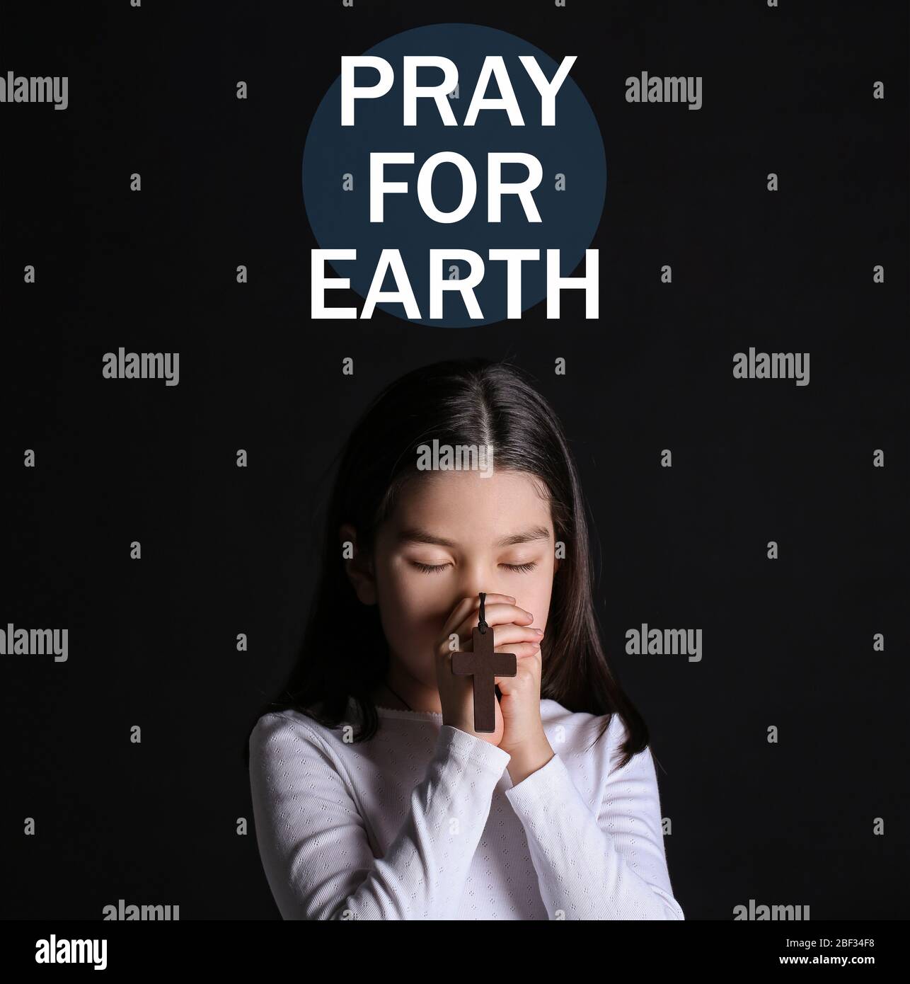 Cute little Asian girl praying for Earth on dark background Stock Photo ...