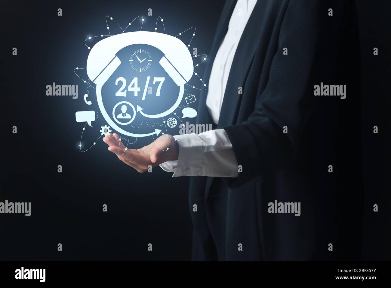 Technical support agent with icon of virtual call center on dark ...