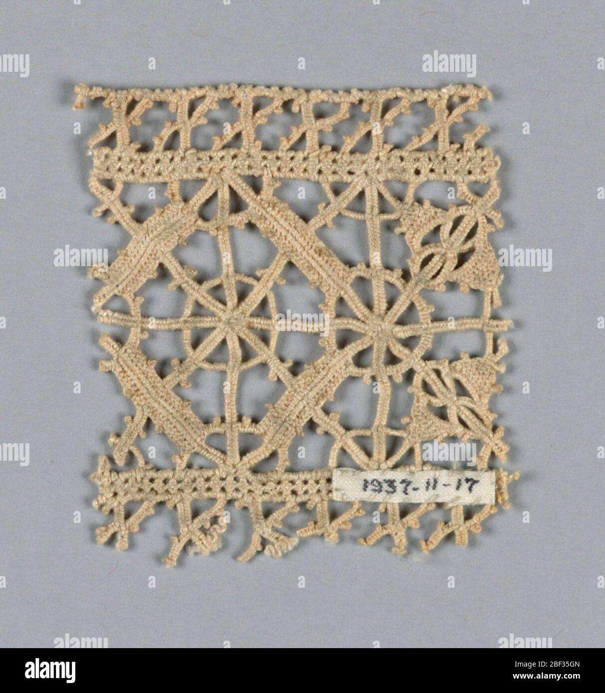 Fragment. Fragment of reticella with a broad central band in a design ...