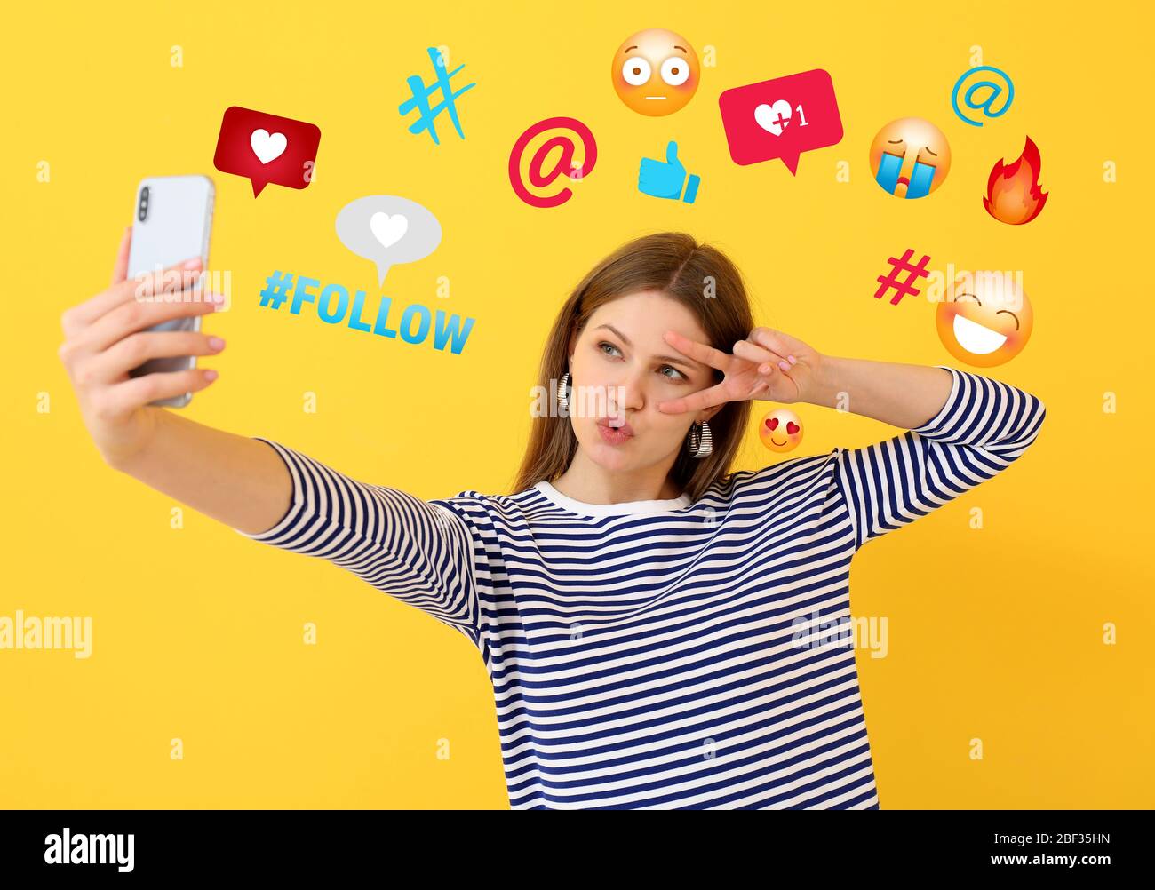 Beautiful female blogger taking selfie on color background Stock Photo ...