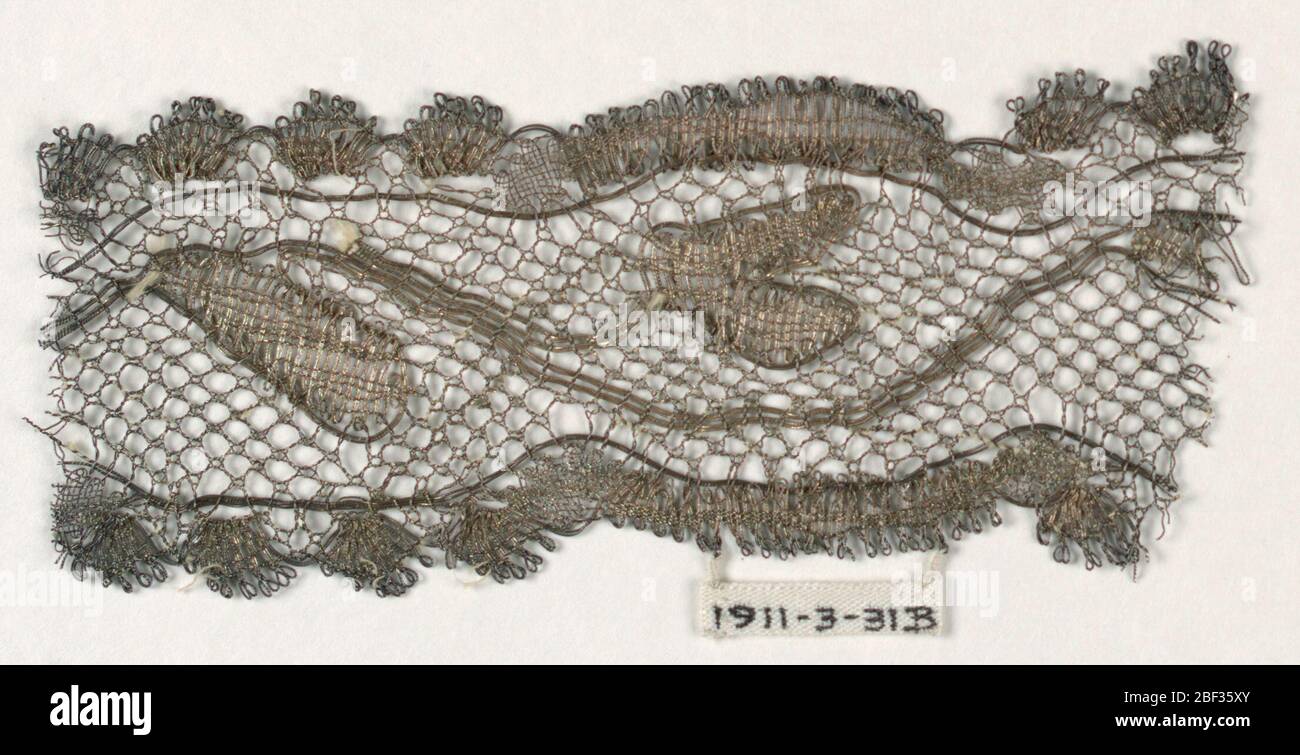 Fragment. Fragment has a design of a curving stem with leaves and ...