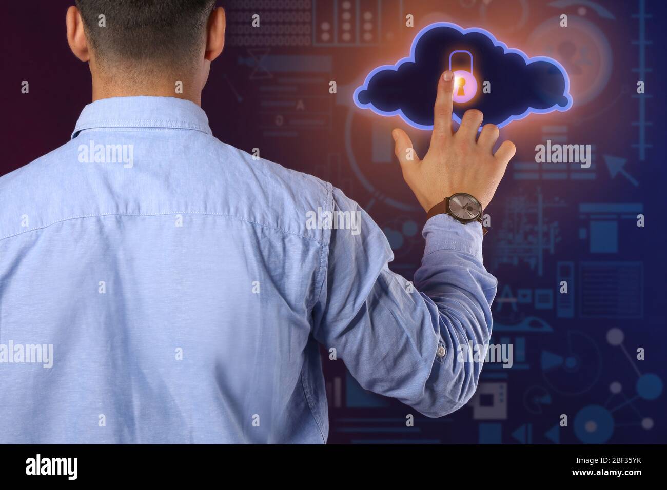 Businessman using cloud storage service against dark background Stock ...