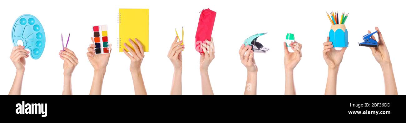 Many hands with school supplies on white background Stock Photo - Alamy