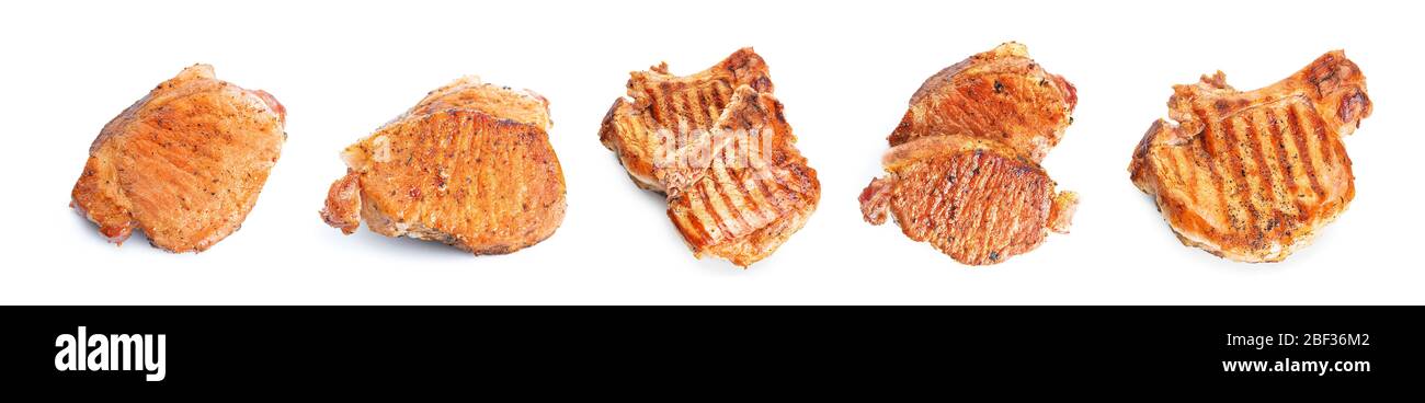 Cooked pork steaks on white background Stock Photo - Alamy