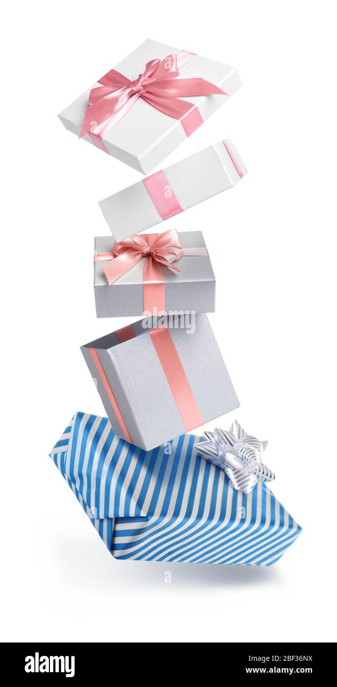 Beautiful falling gift boxes on white background Stock Photo - Alamy