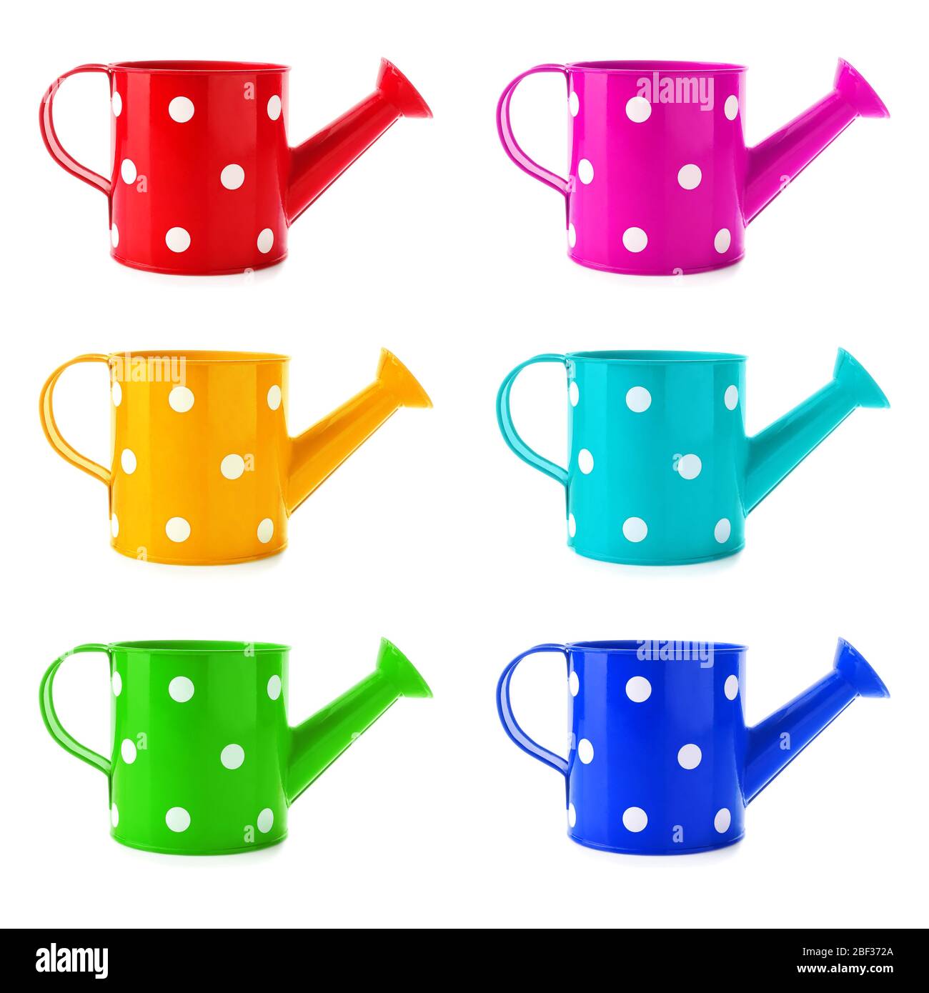 Many colorful watering cans hi-res stock photography and images - Alamy