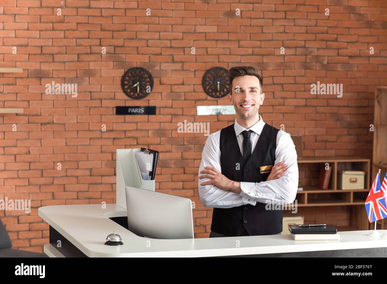 Portrait of male receptionist in hotel Stock Photo - Alamy