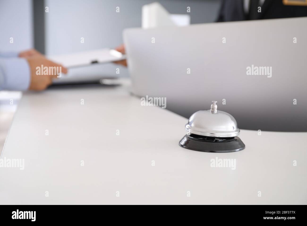 Service bell on reception desk in office Stock Photo - Alamy