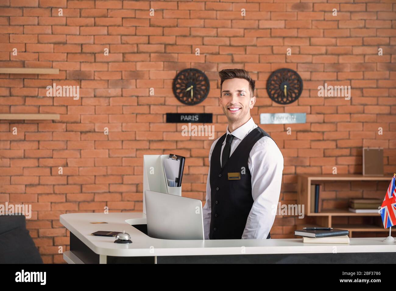 Portrait of male receptionist in hotel Stock Photo - Alamy