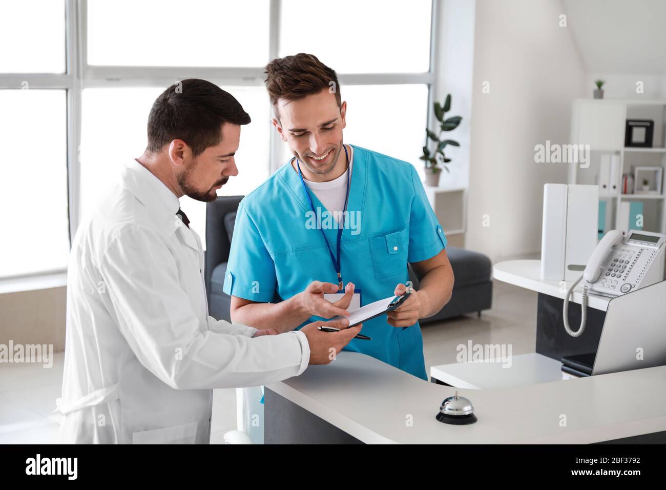 Male receptionist doctor hi-res stock photography and images - Alamy