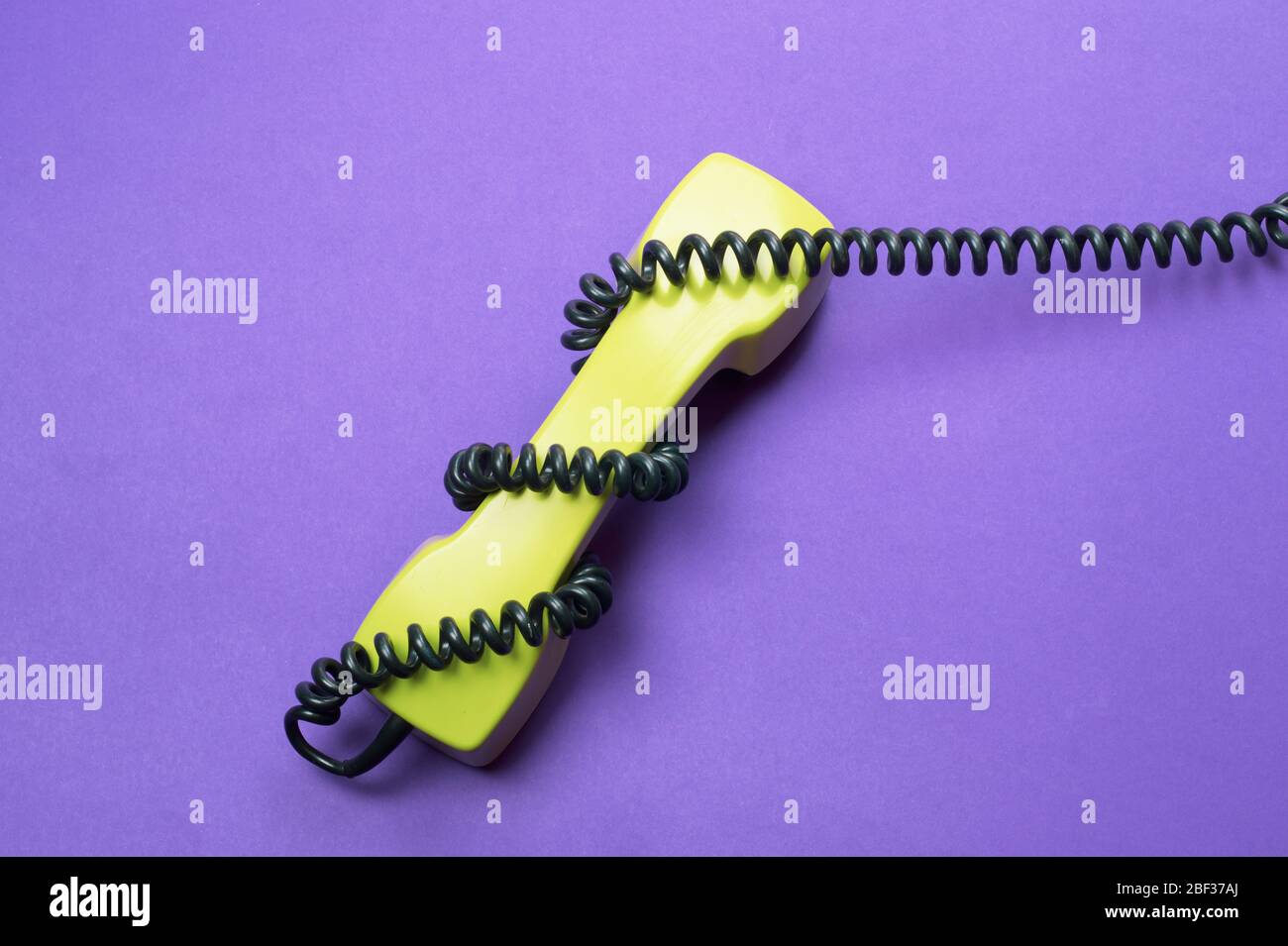 Vintage telephone handset. phone receiver isolated on purple background ...