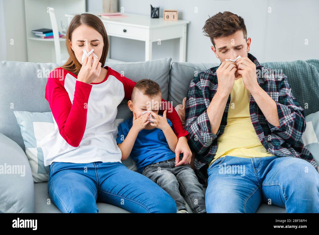 Family suffering from allergy at home Stock Photo - Alamy