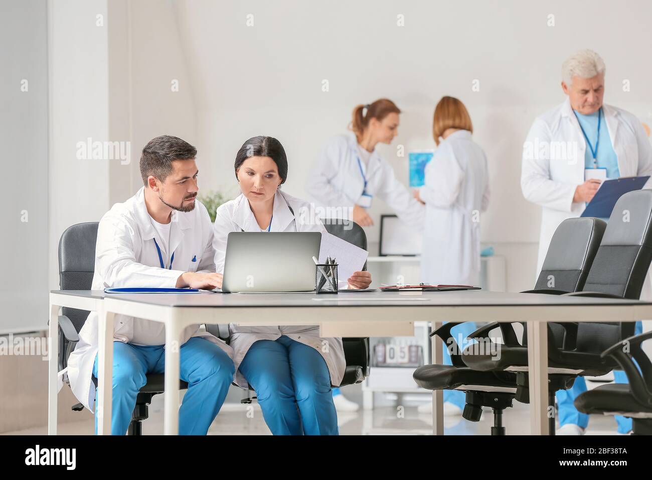 Team of doctors during meeting in clinic Stock Photo - Alamy