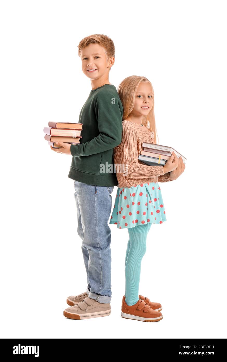 Little children with books on white background Stock Photo - Alamy