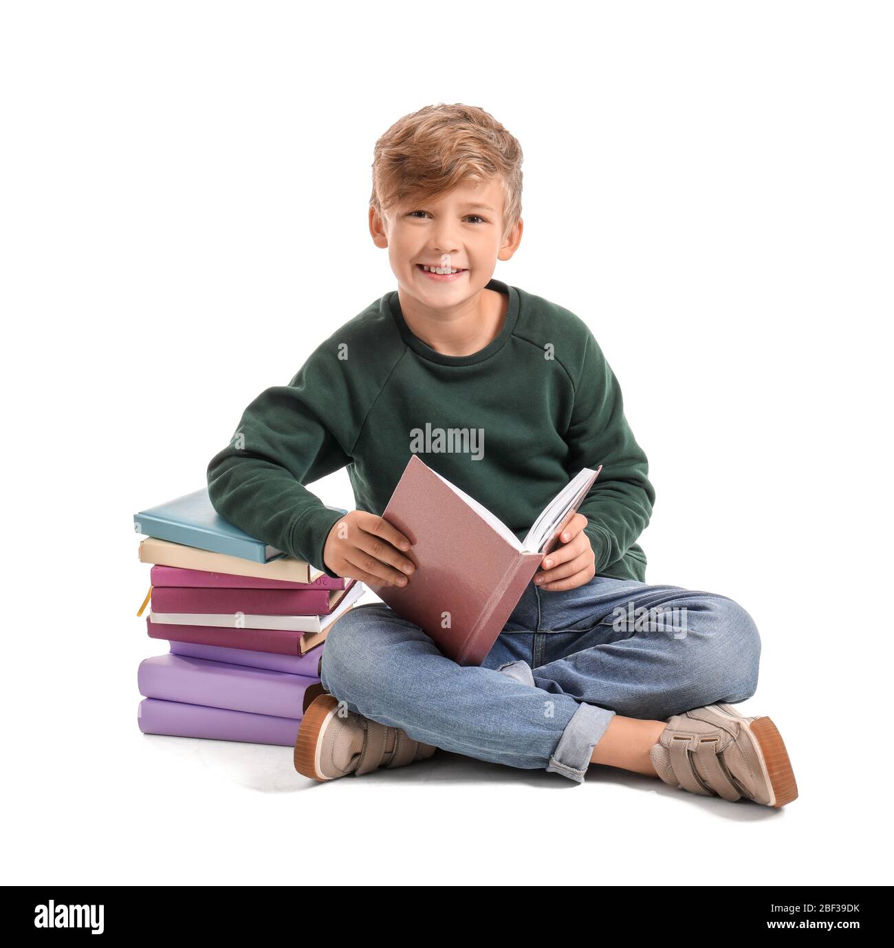 Little boy reading book on white background Stock Photo - Alamy