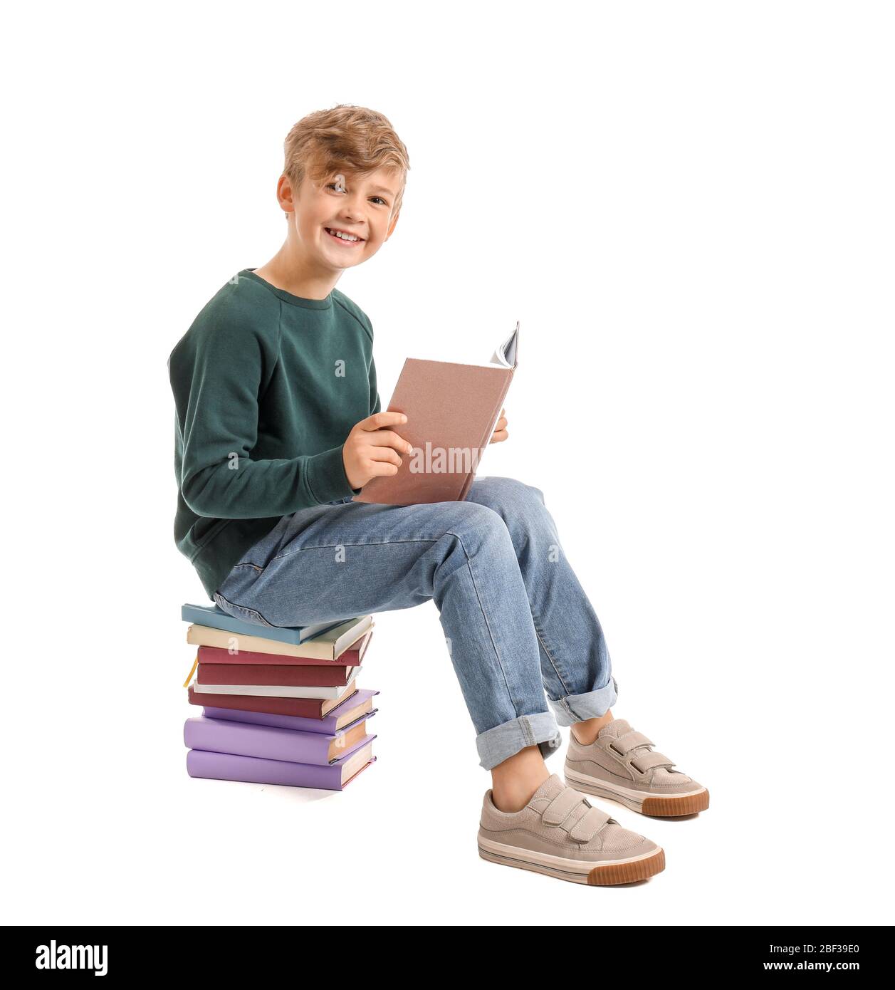 Little boy reading book on white background Stock Photo - Alamy