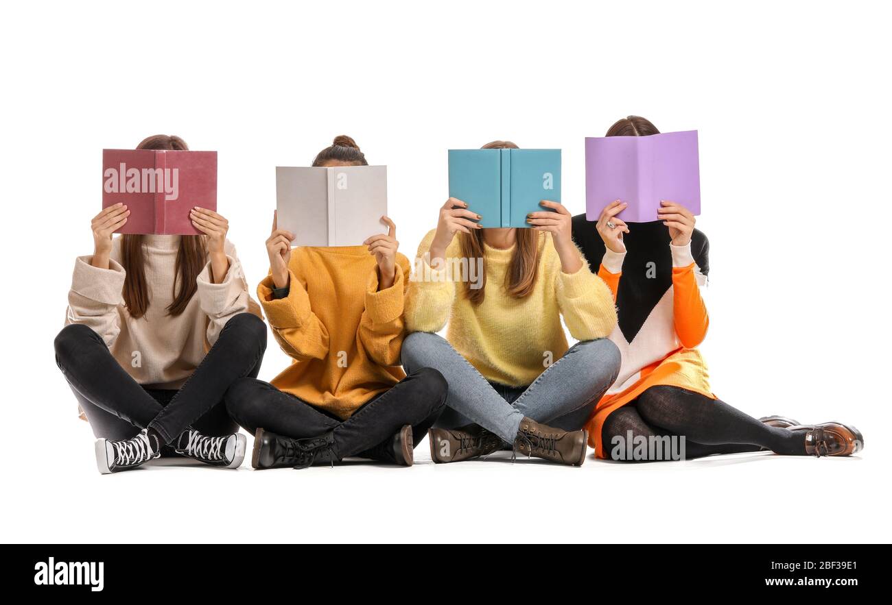 Young women with books on white background Stock Photo - Alamy