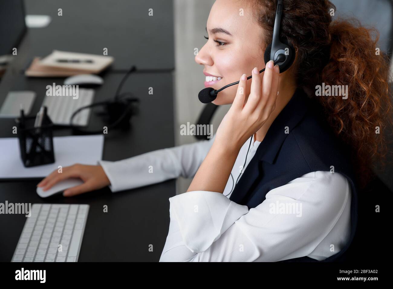 Technical support agent working in office Stock Photo - Alamy