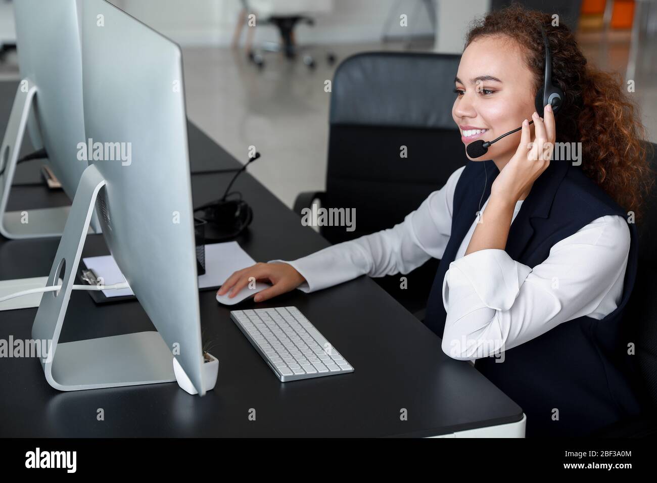 Technical support agent working in office Stock Photo - Alamy