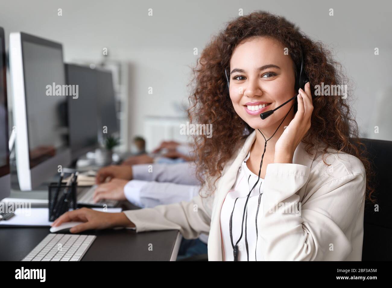 Portrait of female technical support agent in office Stock Photo - Alamy