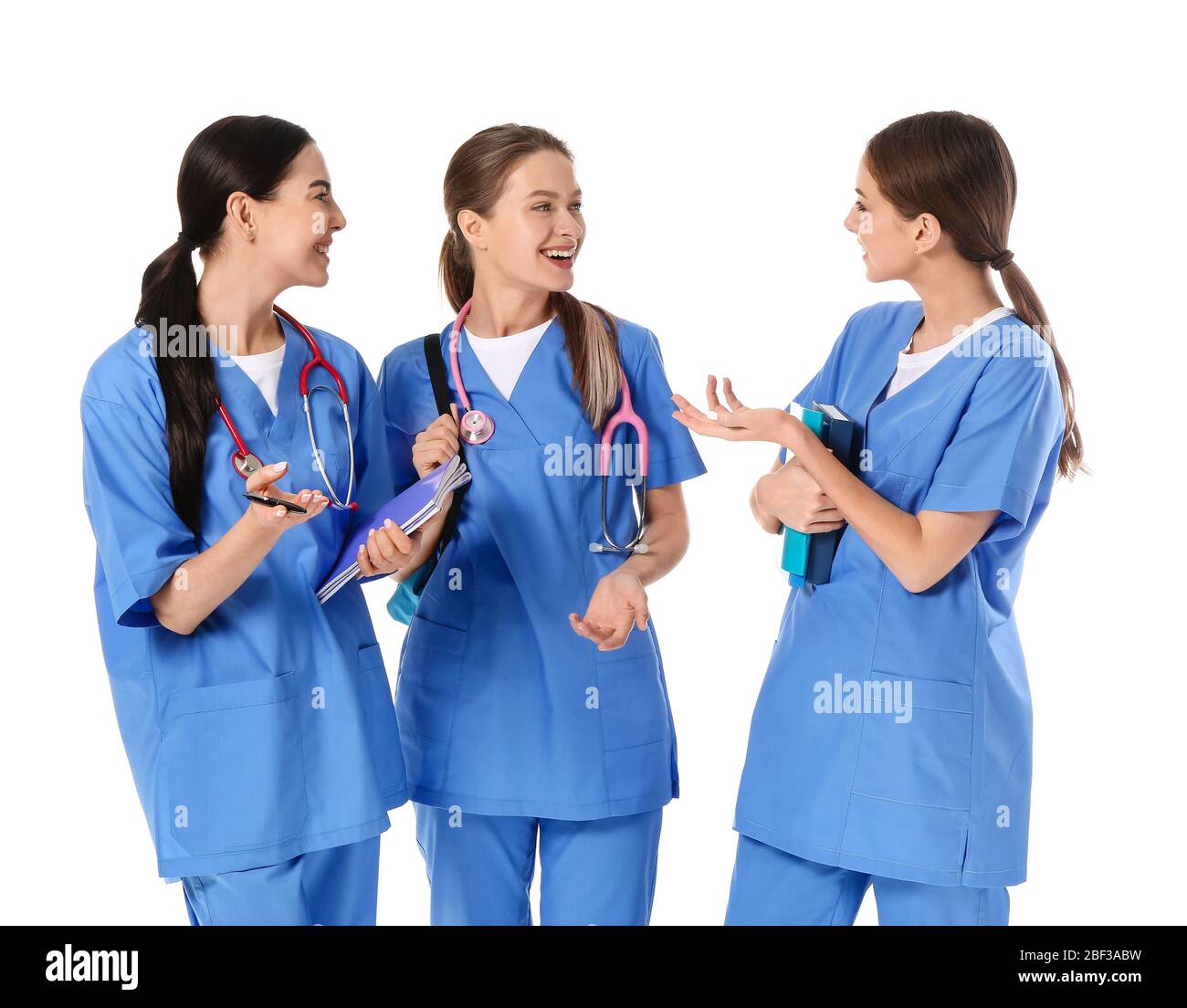 Female medical students on white background Stock Photo - Alamy